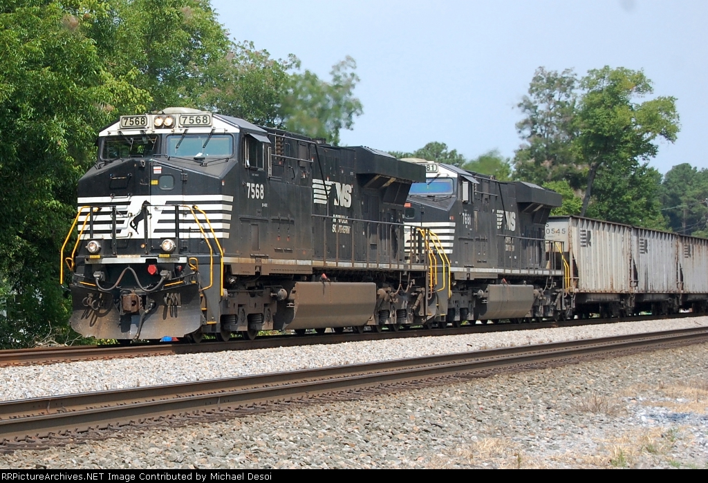 NS ES-40DC #7568 leads an eastbound coal train across Main St.